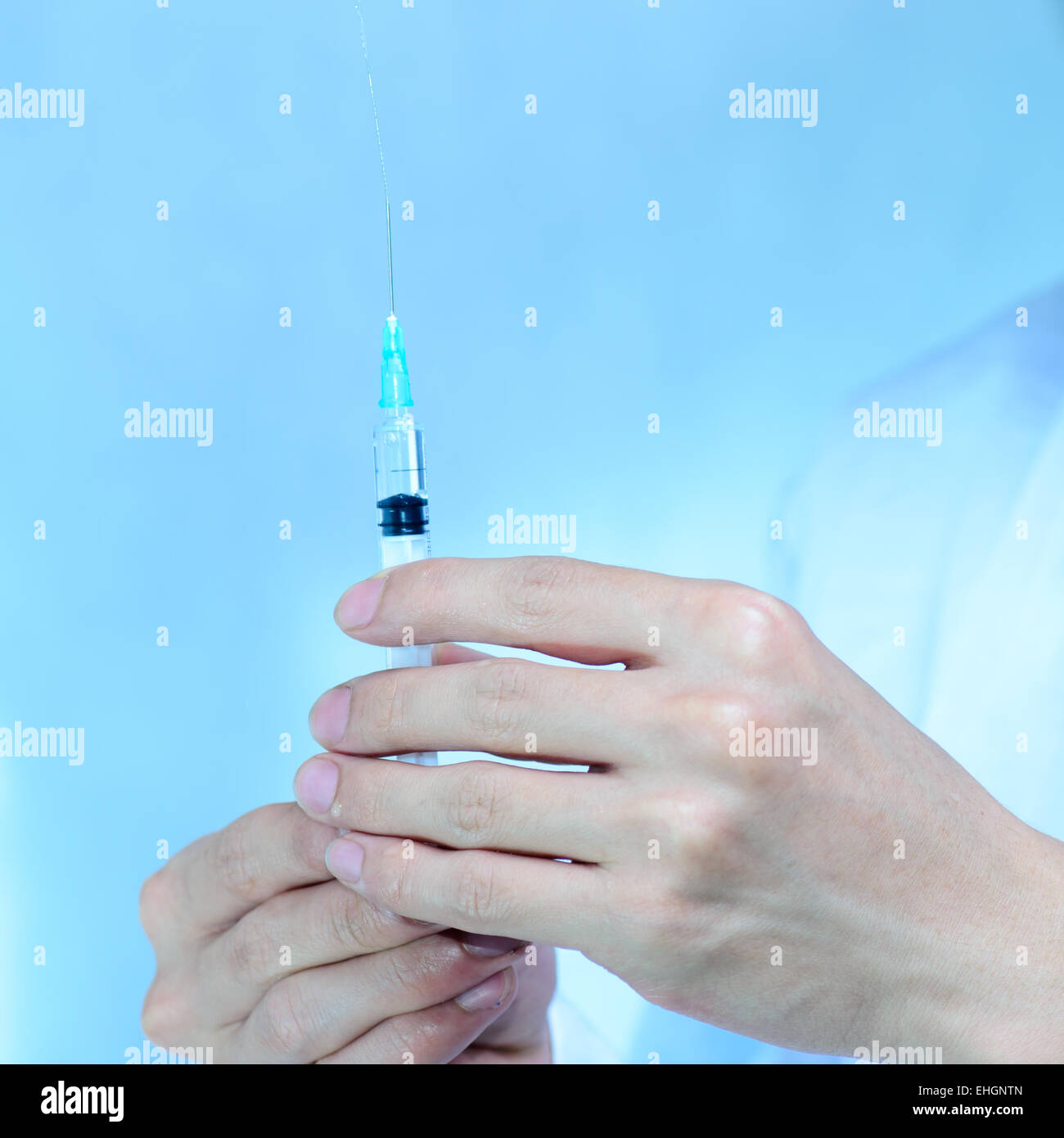 doctor with medical syringe in hand Stock Photo - Alamy