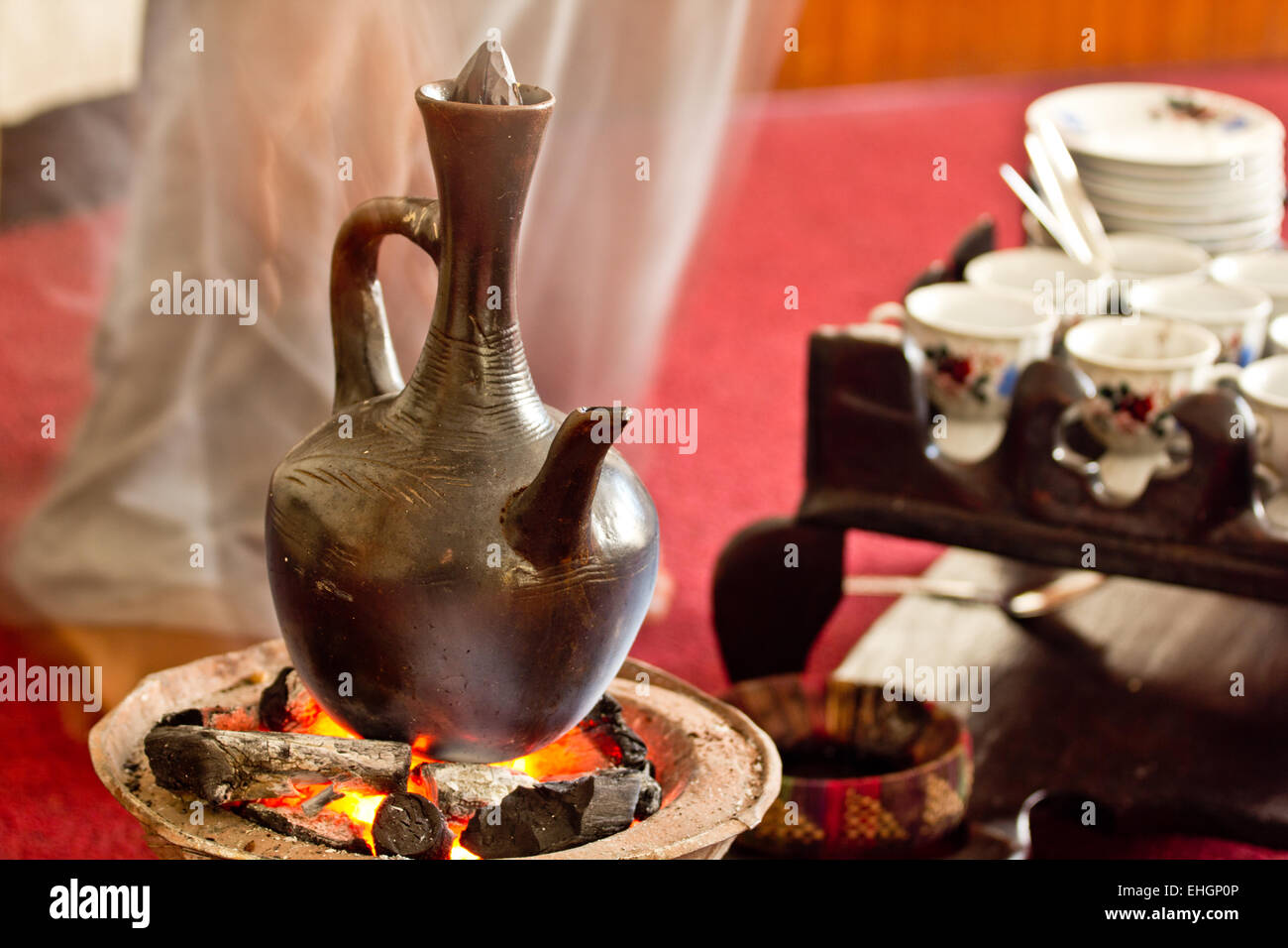 Brewing coffee with Jebena using coal Stock Photo - Alamy