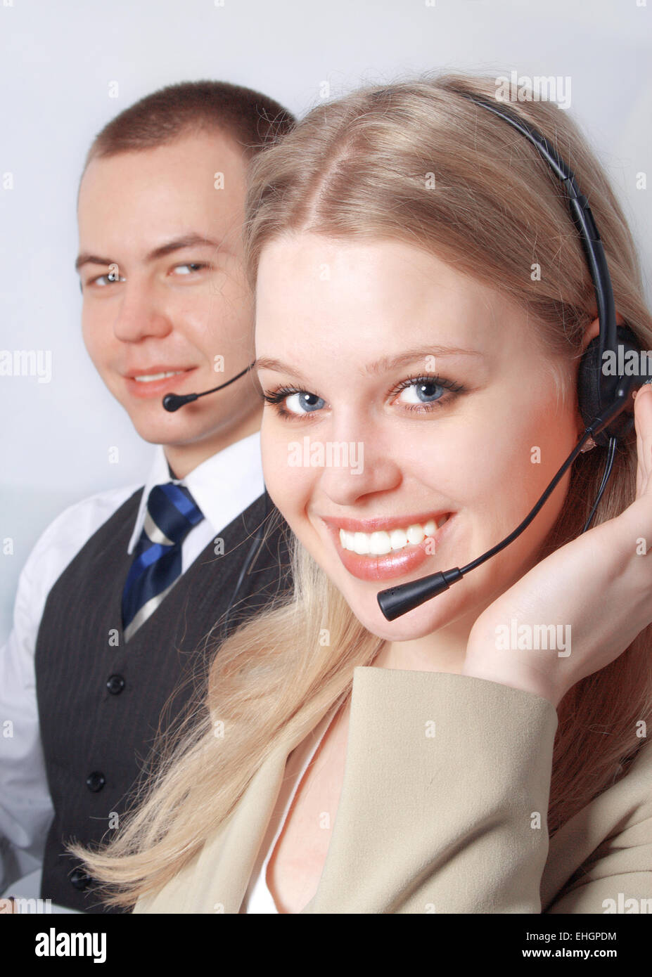 Successful customer service people smiling Stock Photo - Alamy