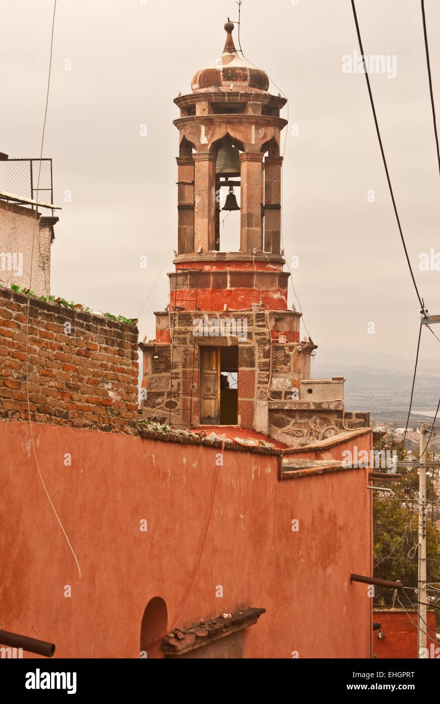Mexican rooftop with belltower Stock Photo - Alamy