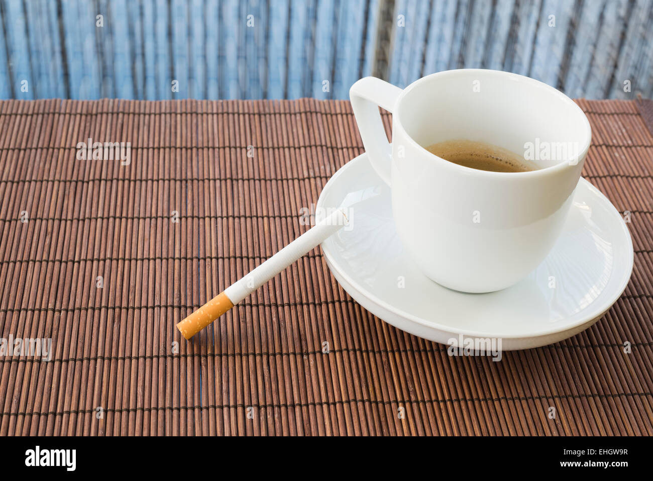 Cup of coffee and cigarette composition Stock Photo - Alamy