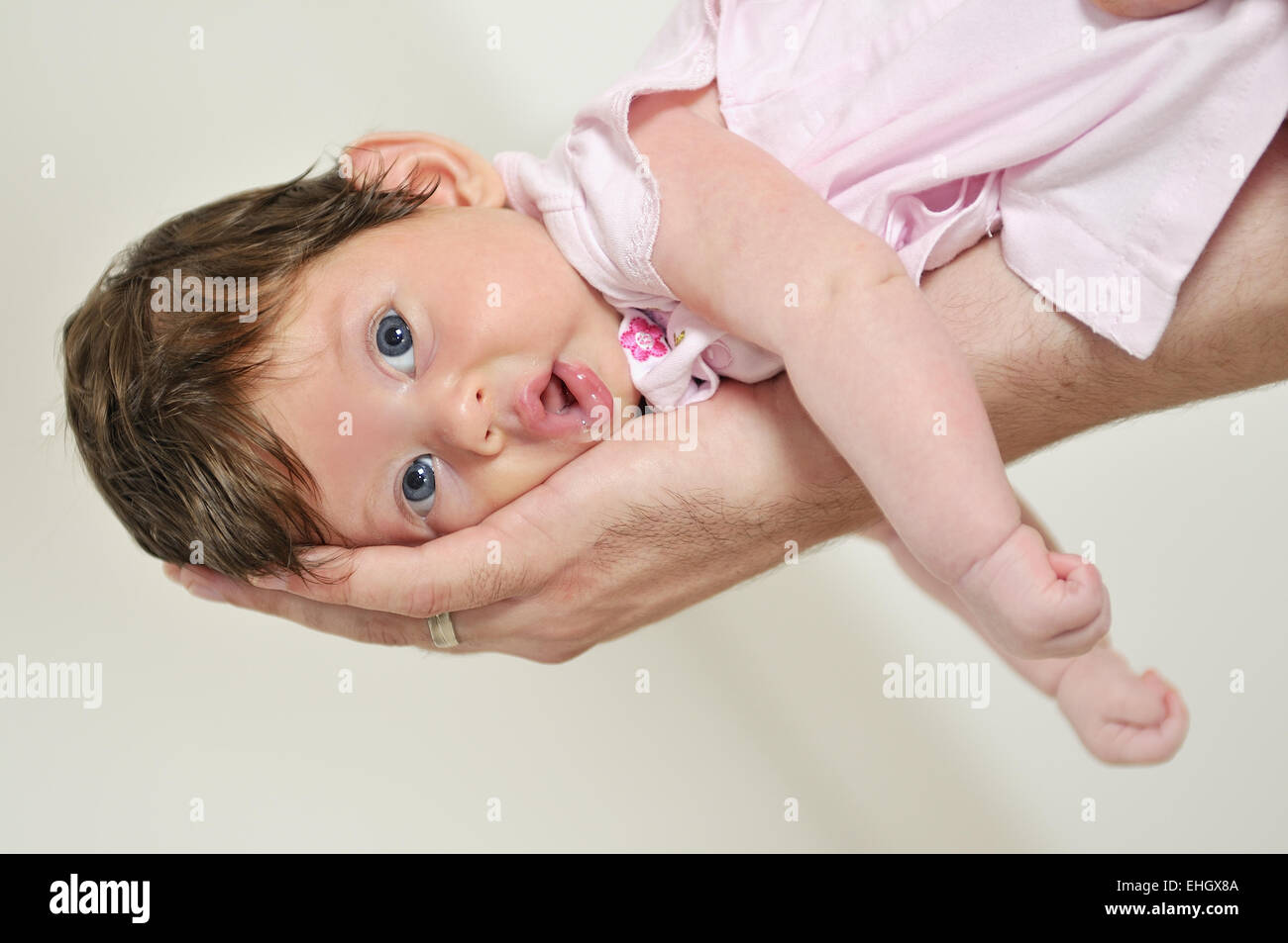 man hold little baby in hand Stock Photo - Alamy