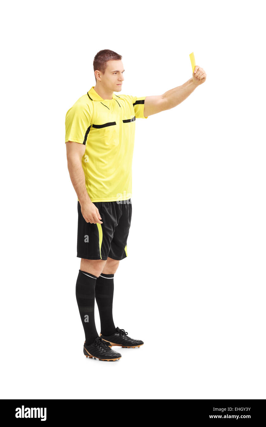 Full length portrait of a football referee showing a yellow card ...
