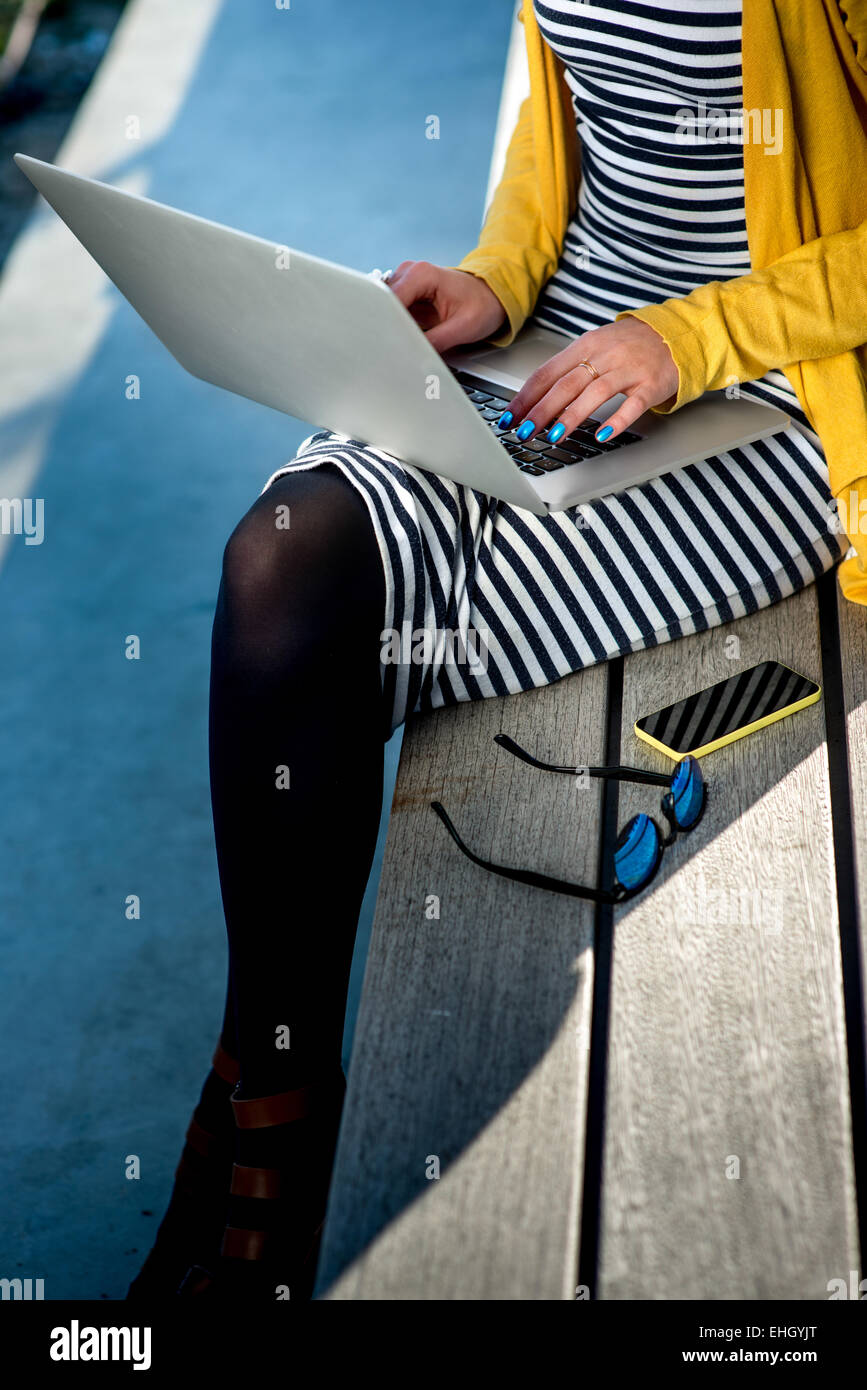 Woman writer with laptop Stock Photo - Alamy