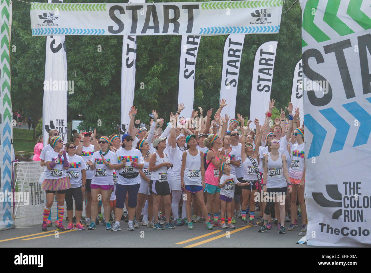 Excited Color Run racers prepare to take off from the starting line on ...