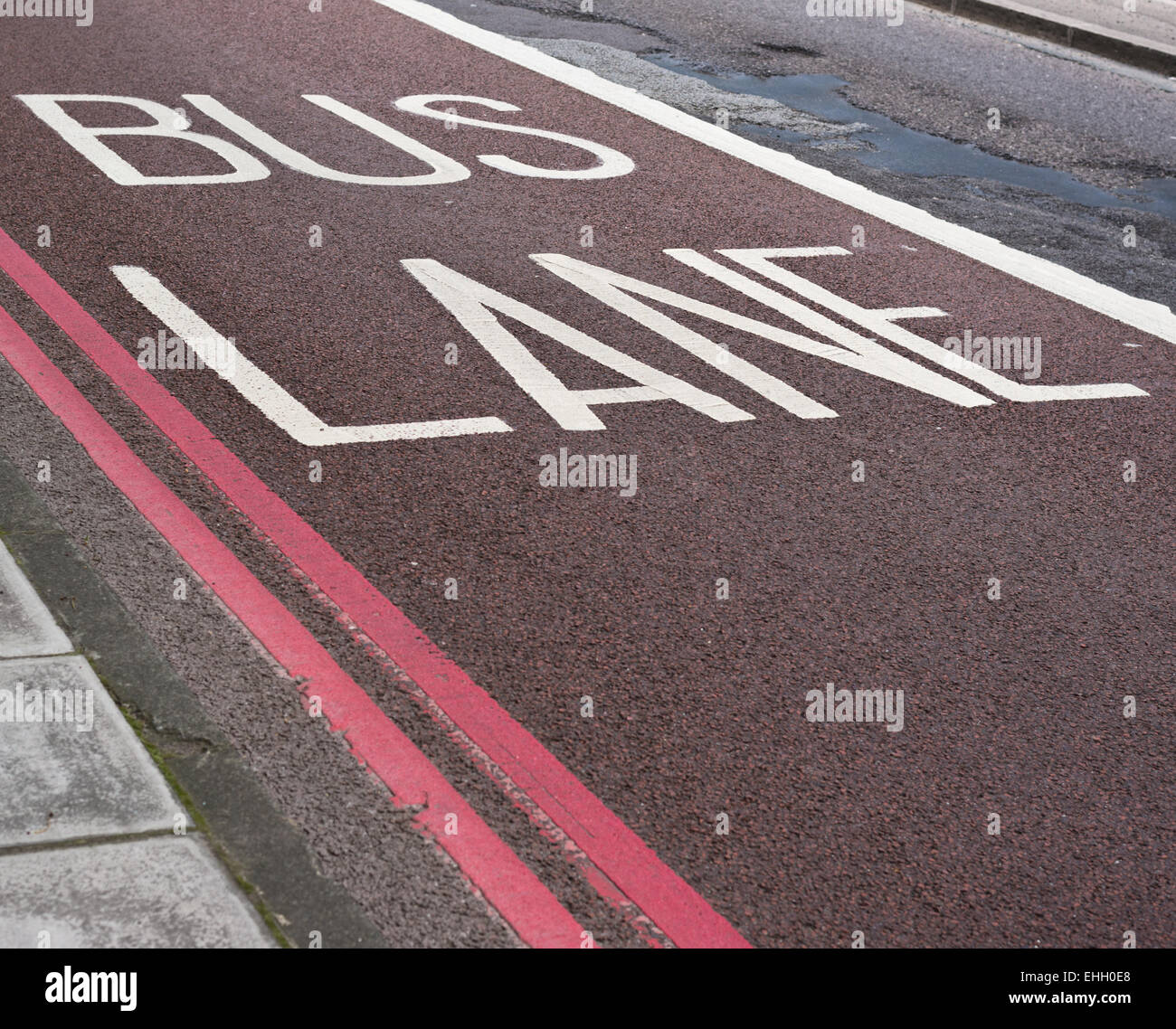 Bus lane road marking Stock Photo - Alamy