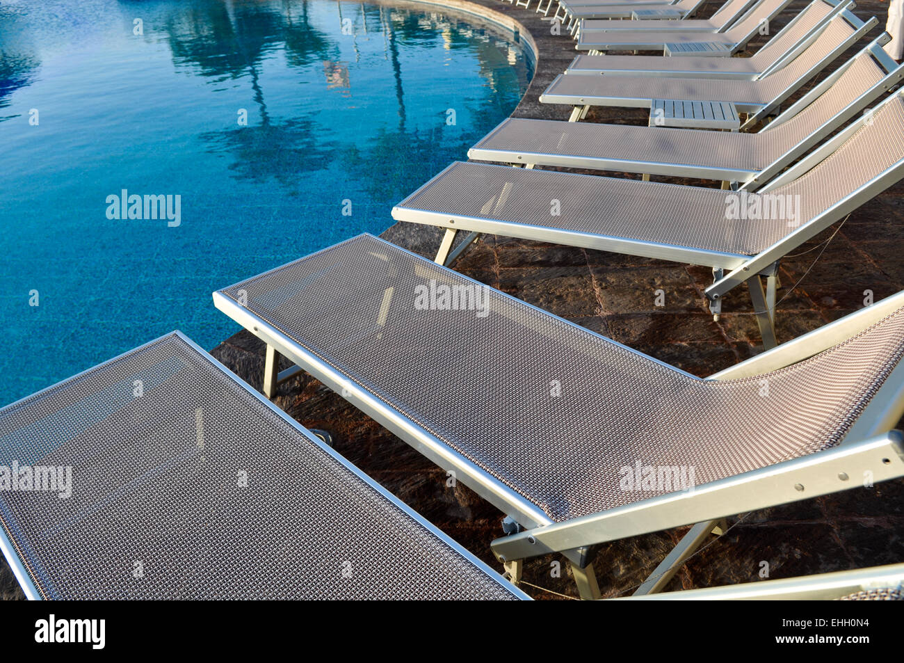 Lounge chairs around swimming hi-res stock photography and images - Alamy