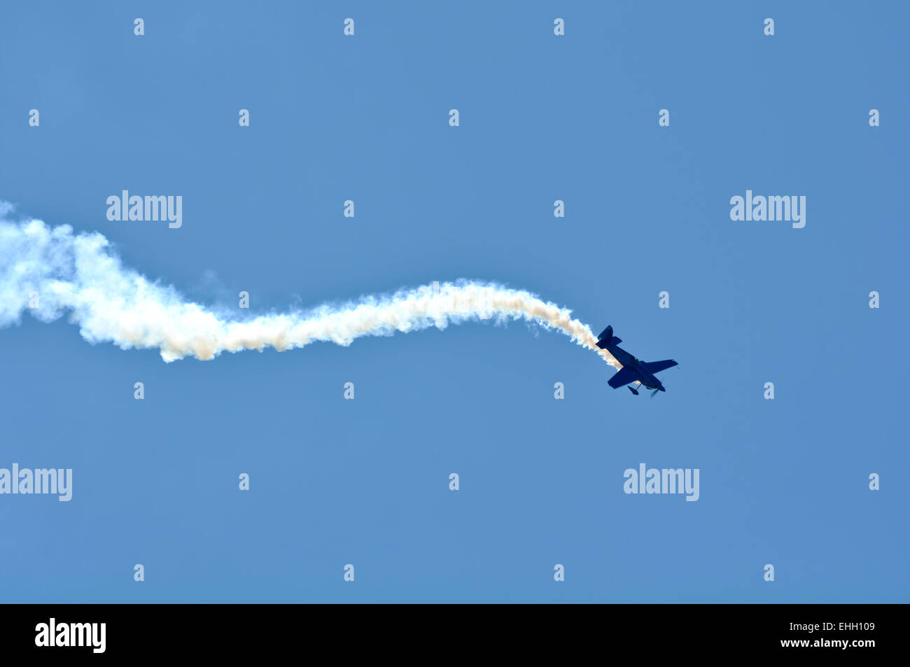 Trick Airplane with Smoke Stock Photo - Alamy