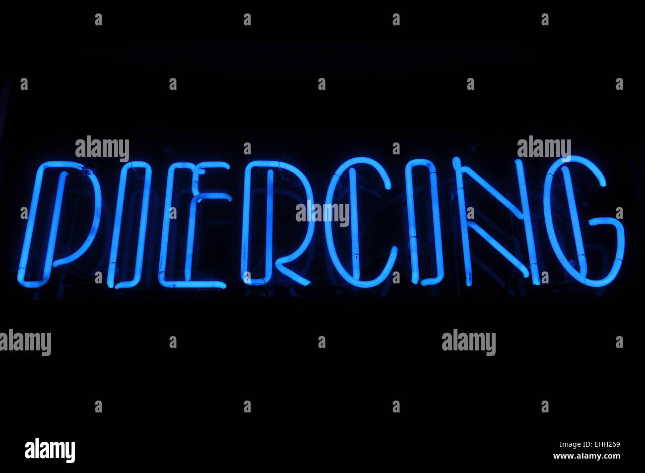 Piercing Electric Blue Neon Sign Stock Photo - Alamy