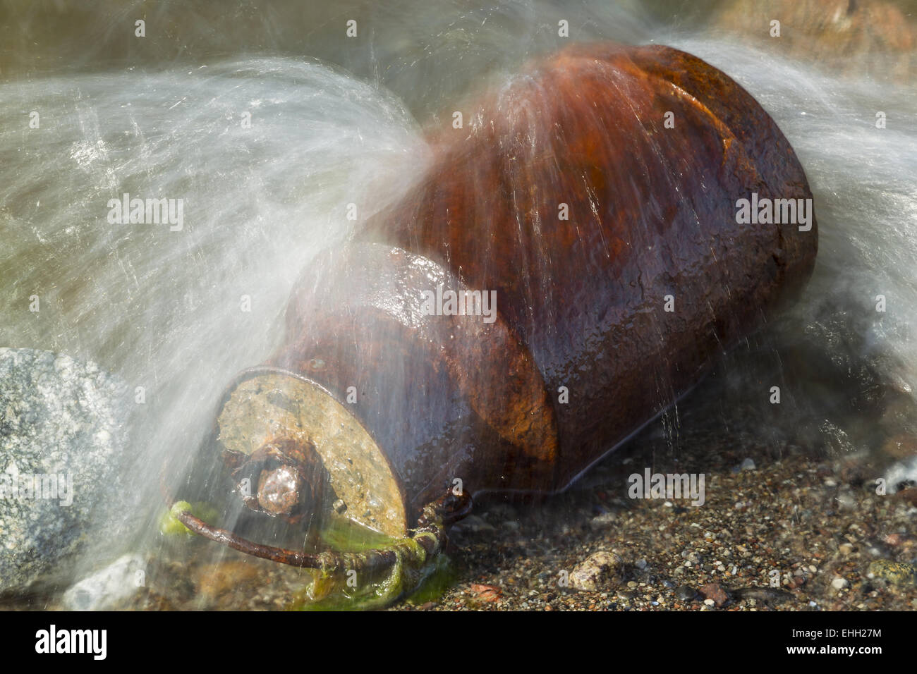 Rusted milk can on the beach shore Stock Photo - Alamy