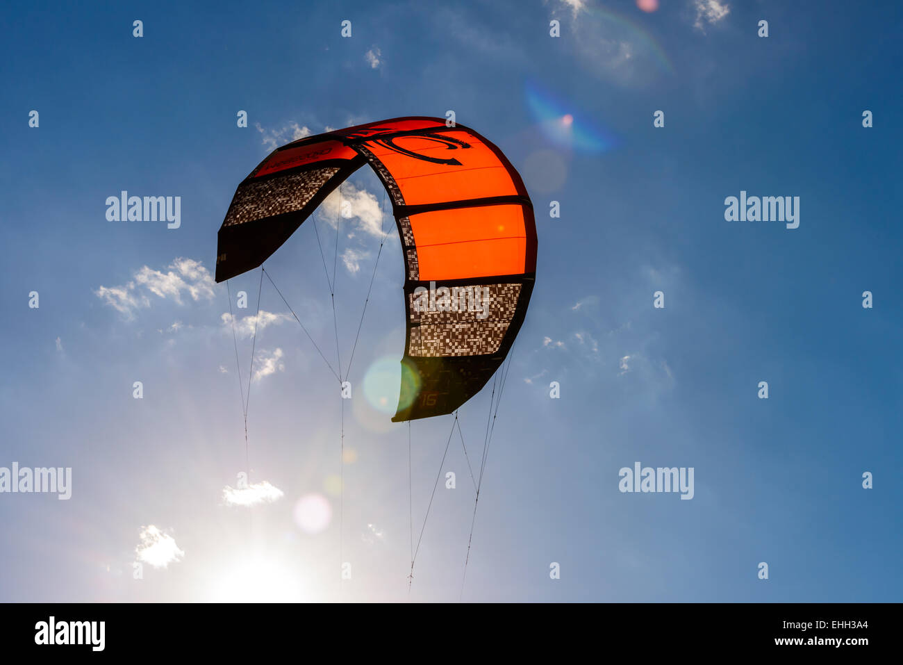 Big kite in the blue sky with some clouds Stock Photo - Alamy