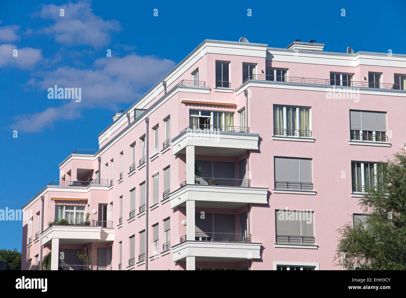 Beautiful pink apartment house Stock Photo - Alamy