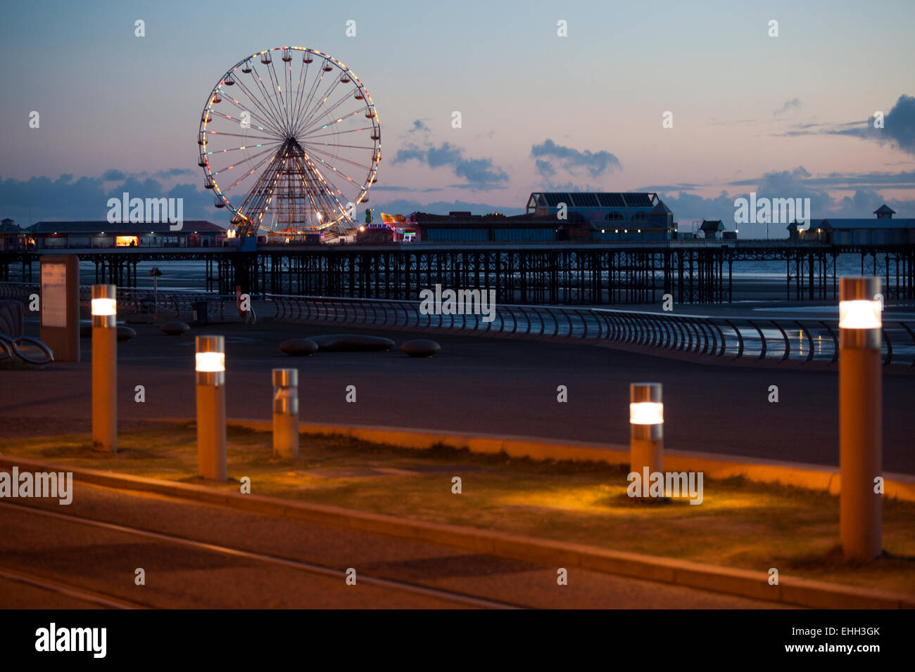 The Big Wheel on the Central pier at dusk, with illuminated bollards on ...