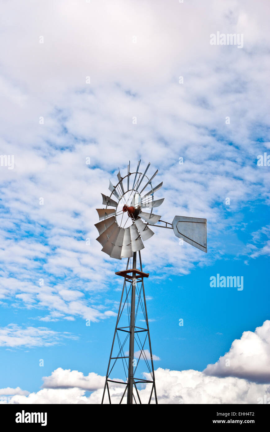 Silver metal windmill in desert pumps water Stock Photo - Alamy