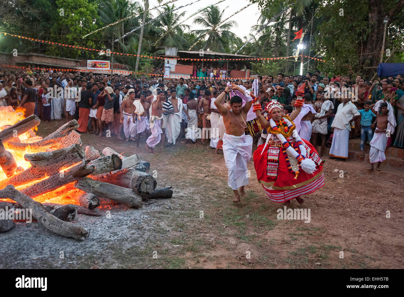 Theyyam Dancer (Tottan), moving around fire during performance Stock ...