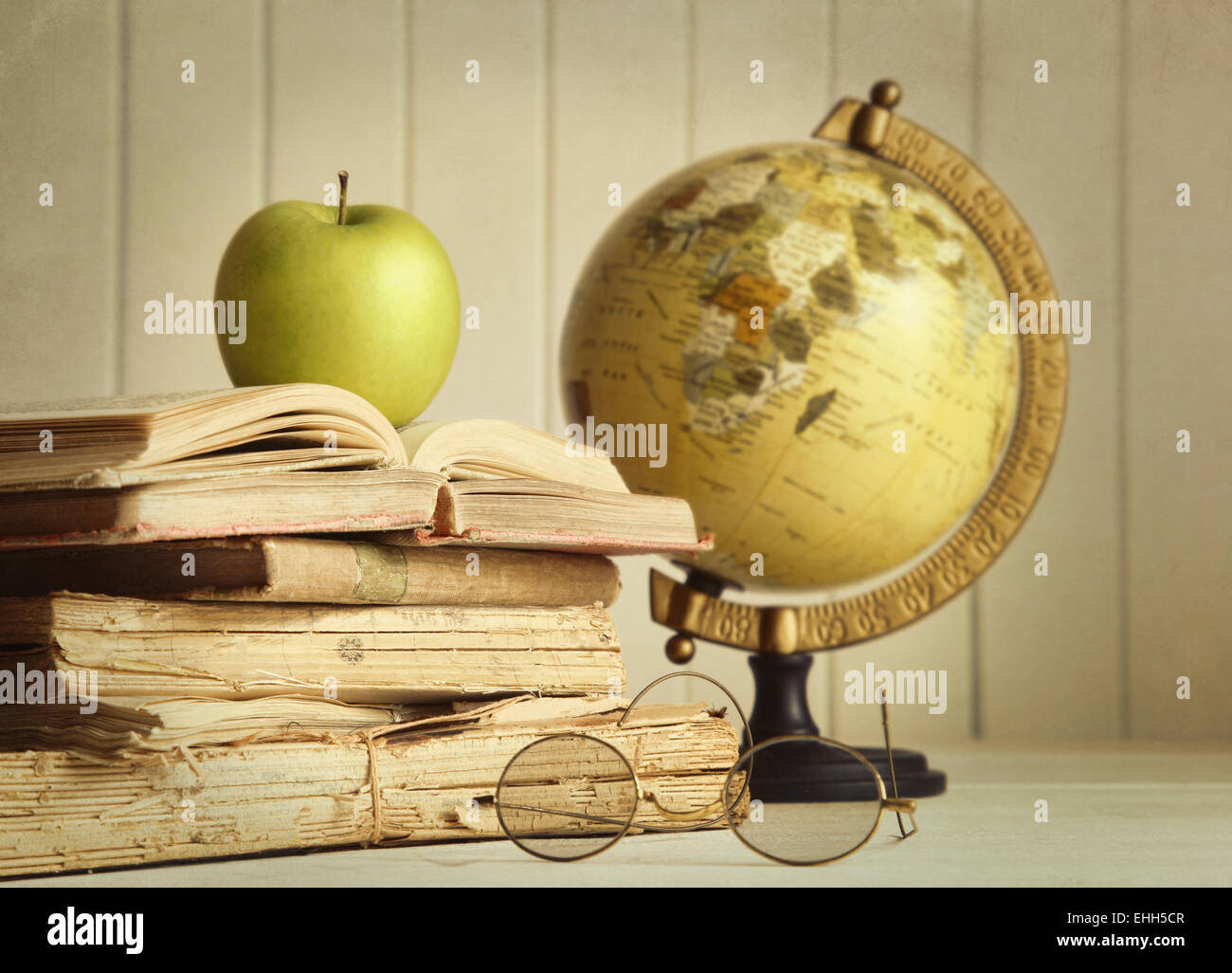 Old books apple globe hi-res stock photography and images - Alamy