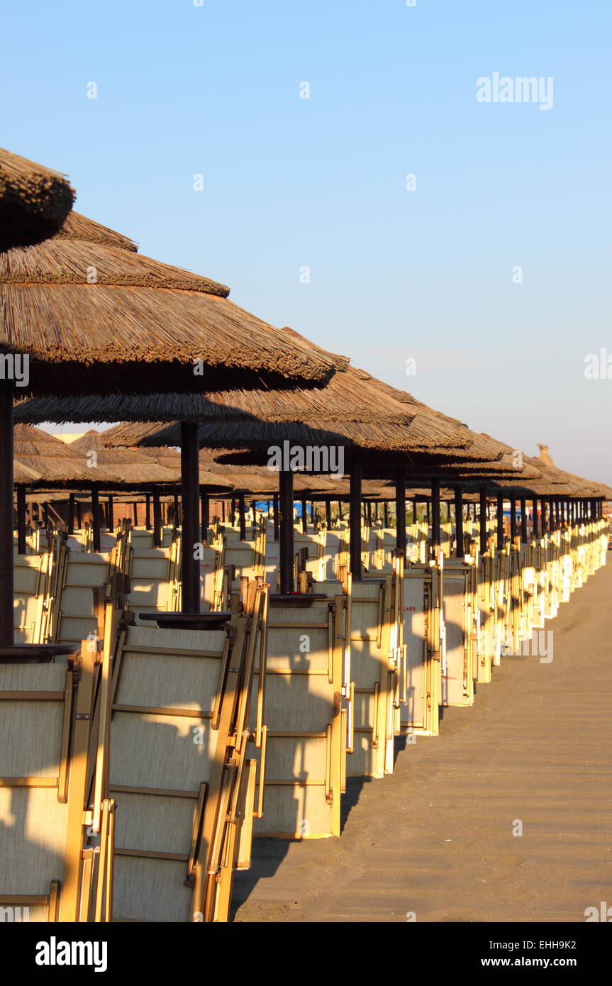 Straw beach umbrellas Stock Photo - Alamy
