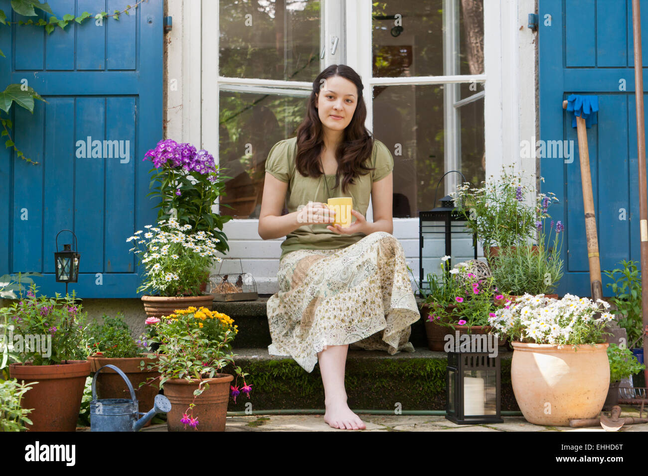 young woman on a patio Stock Photo - Alamy