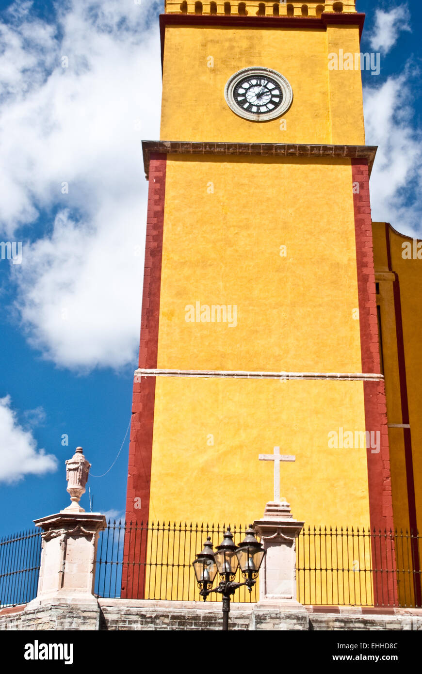 Vibrant yellow clock tower in Guanajuato, Mexico Stock Photo - Alamy