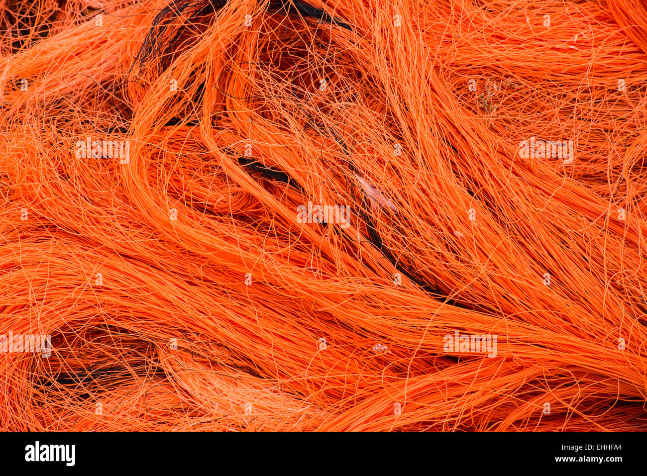 Orange fishing net Stock Photo - Alamy