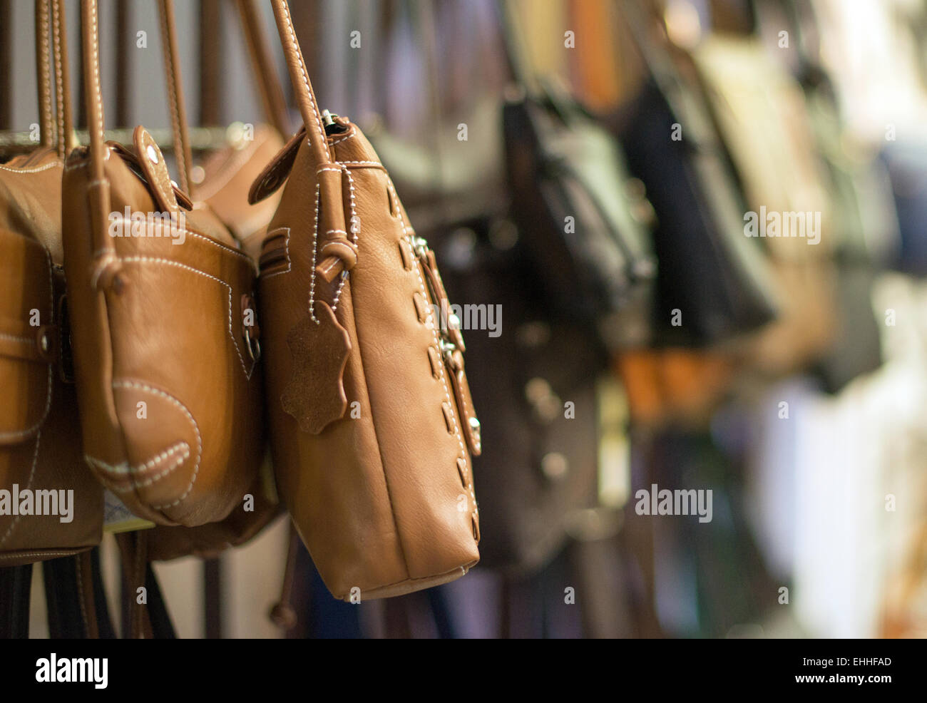 Leather handbags collection in the store Stock Photo - Alamy