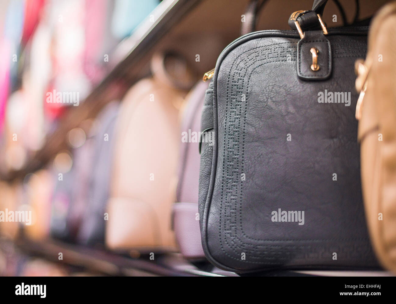 Leather handbags collection in the store Stock Photo - Alamy