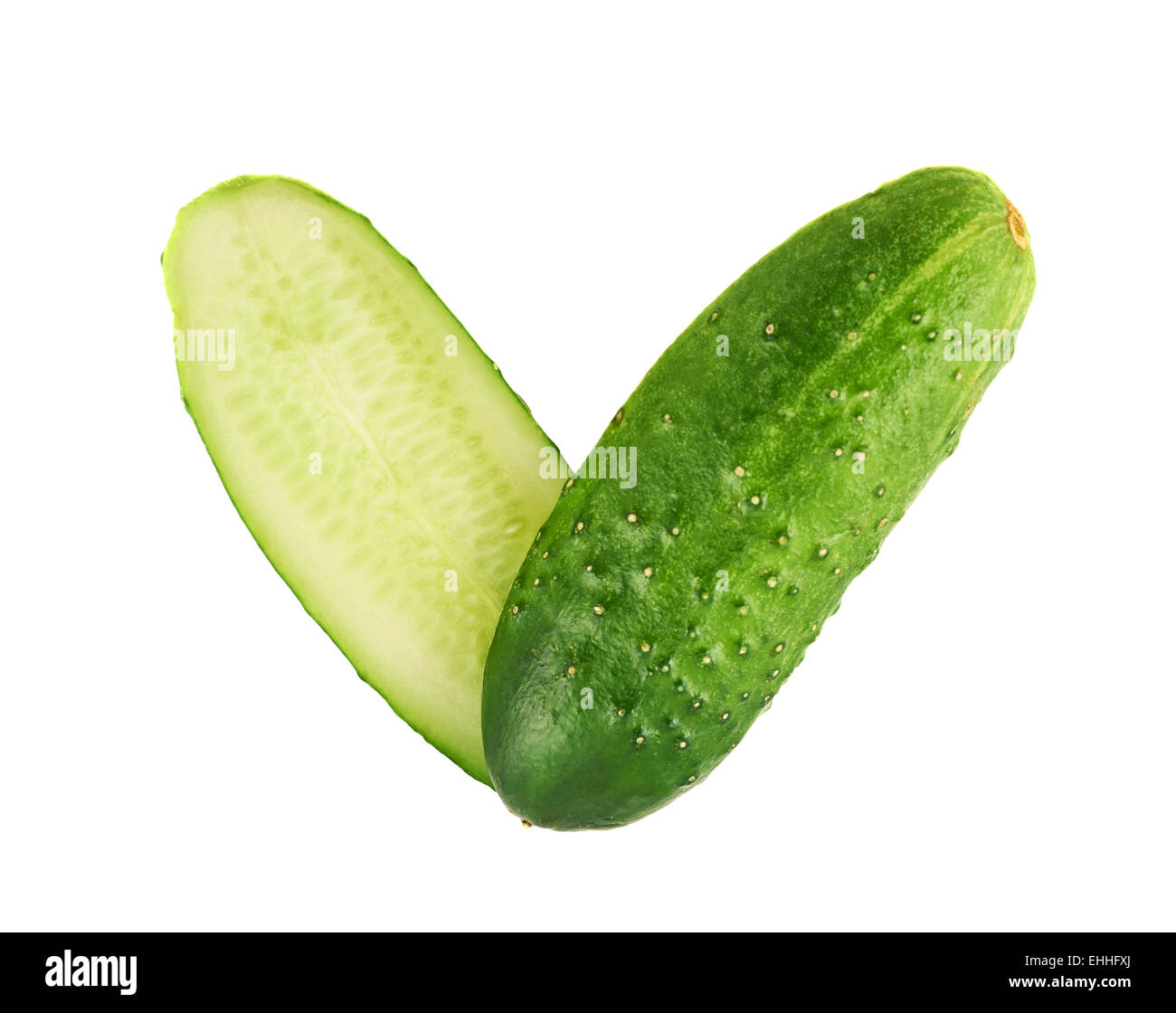Two cucumber halves isolated Stock Photo - Alamy
