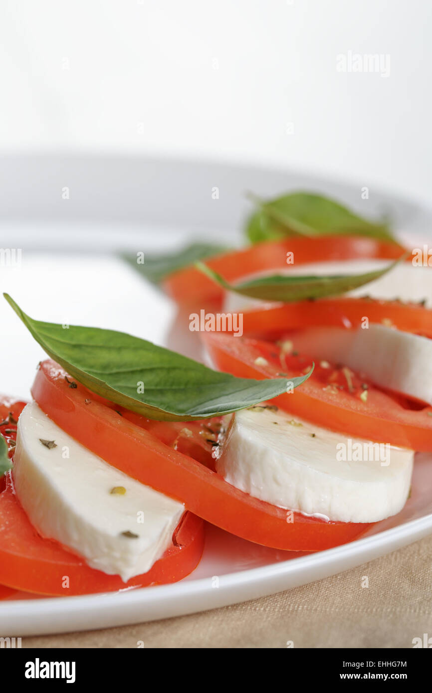 classic caprese salad on plate close up Stock Photo - Alamy