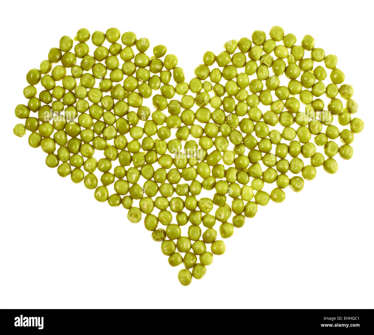 Heart shape made of green peas isolated Stock Photo - Alamy
