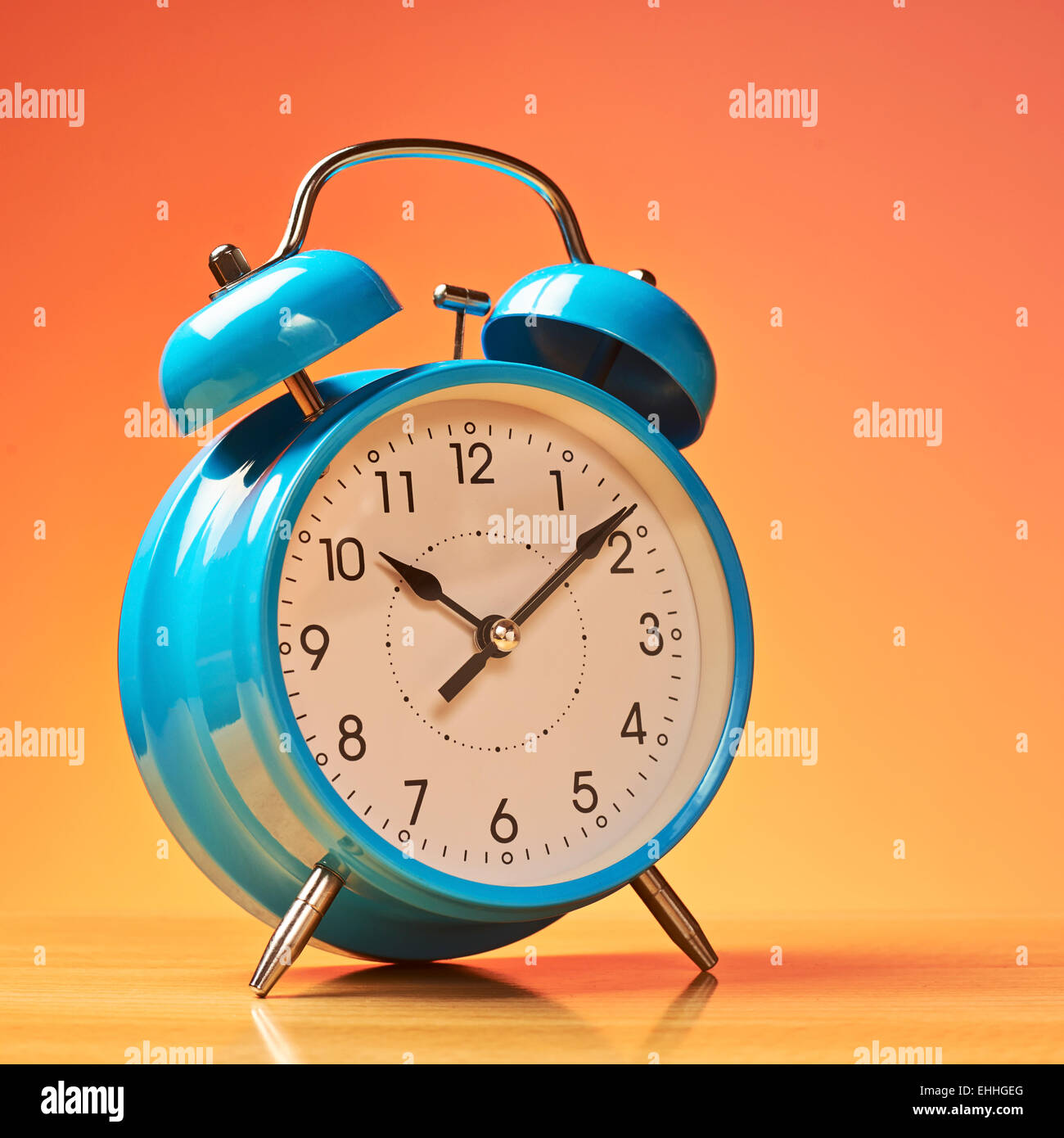 Blue alarm clock Stock Photo - Alamy