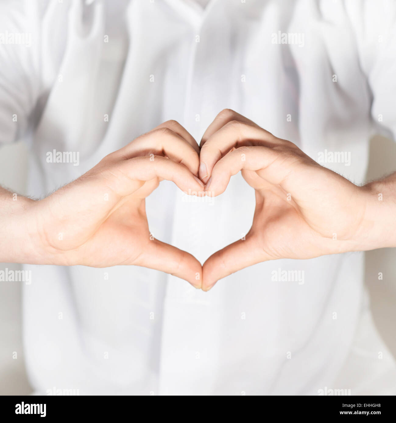Two hands forming a heart Stock Photo - Alamy