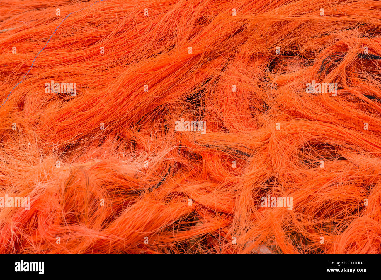 Orange fishing net of nylon rope Stock Photo - Alamy
