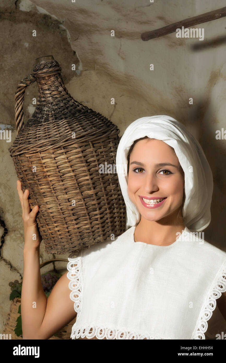 Biblical portrait of a woman depicting mother Mary holding a wine jug ...