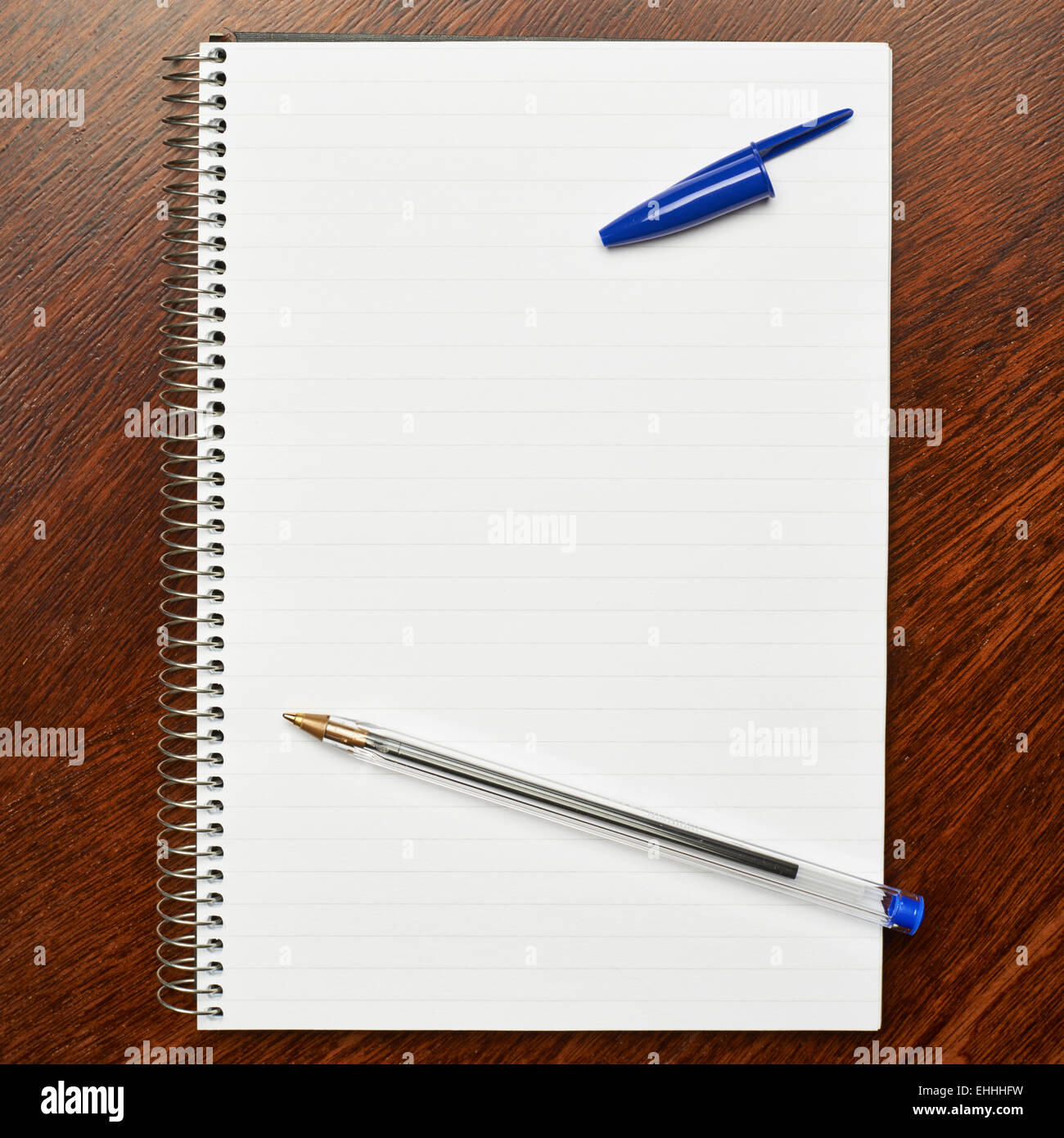 Lined note book over the table Stock Photo - Alamy