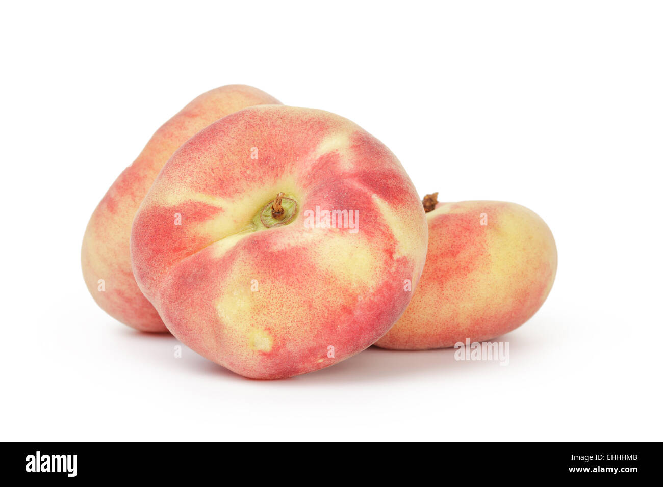 asian flat peaches isolated Stock Photo - Alamy