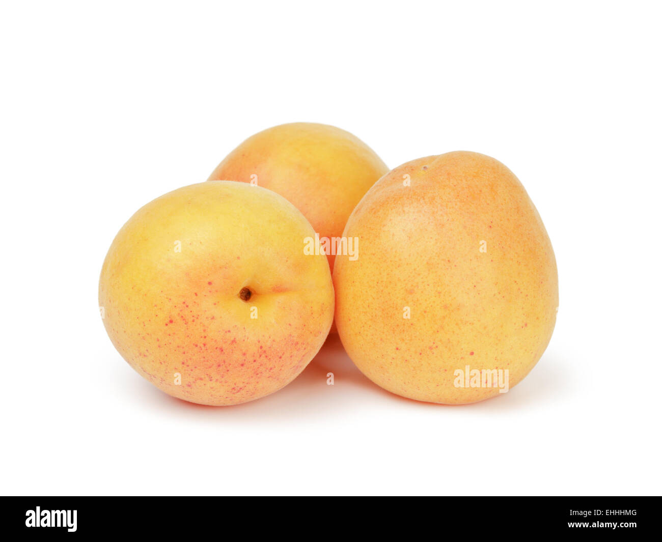 three ripe apricot fruits isolated Stock Photo - Alamy