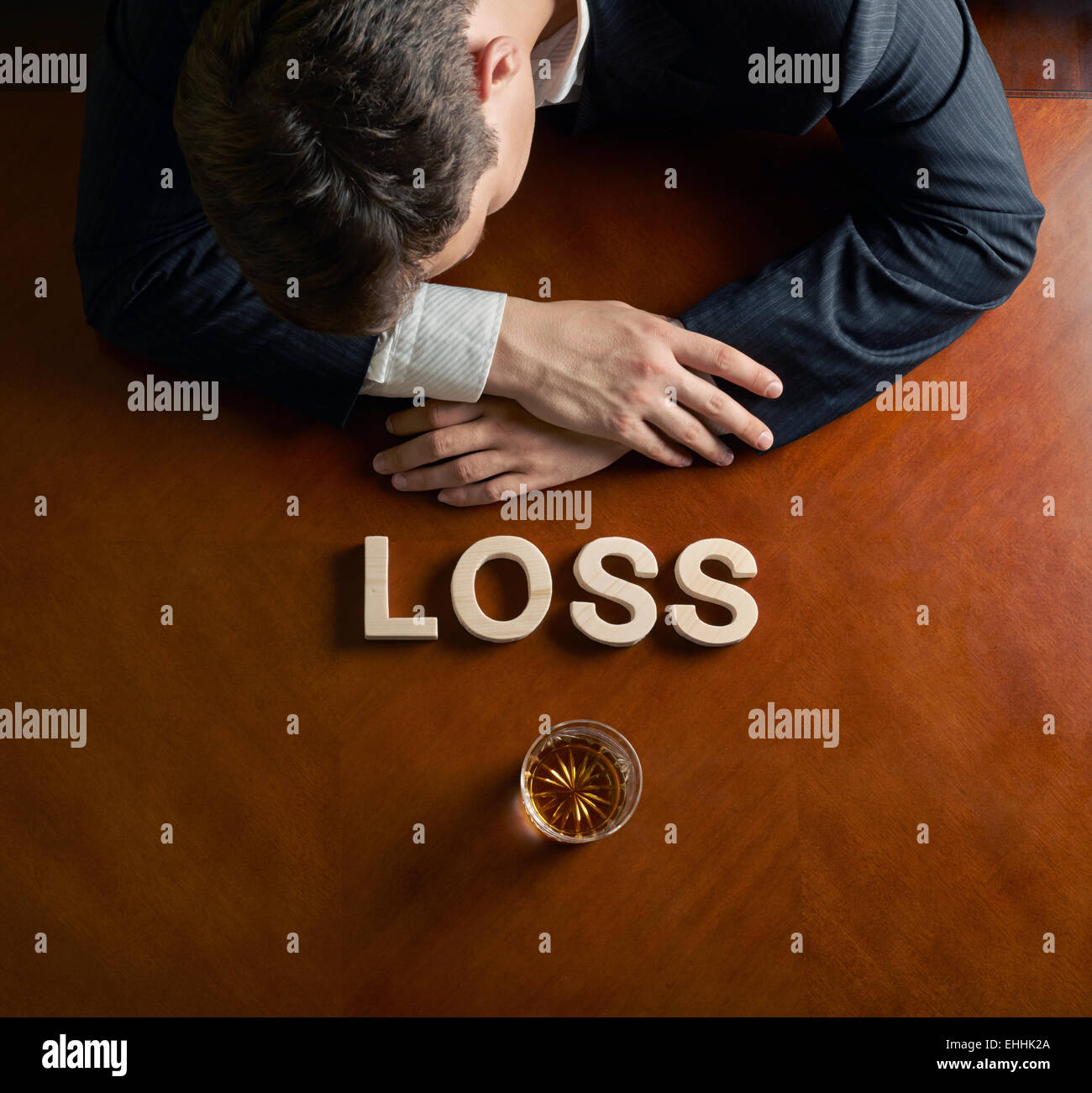 Word Loss and devastated man composition Stock Photo - Alamy