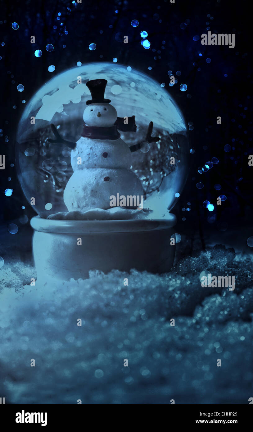 Snow globe in a snowy winter setting Stock Photo - Alamy