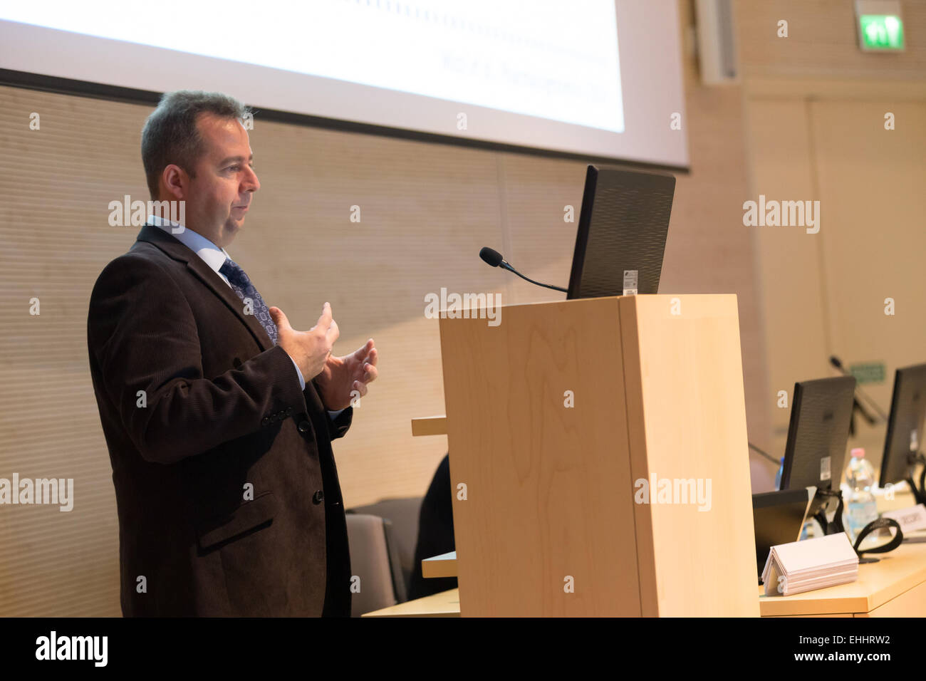 Speaker giving talk on podium at Business Conference Stock Photo - Alamy