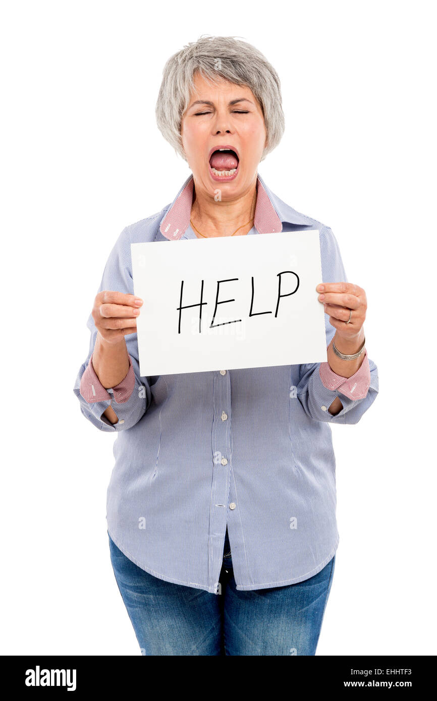 Elderly woman holding a paper card asking for help Stock Photo - Alamy