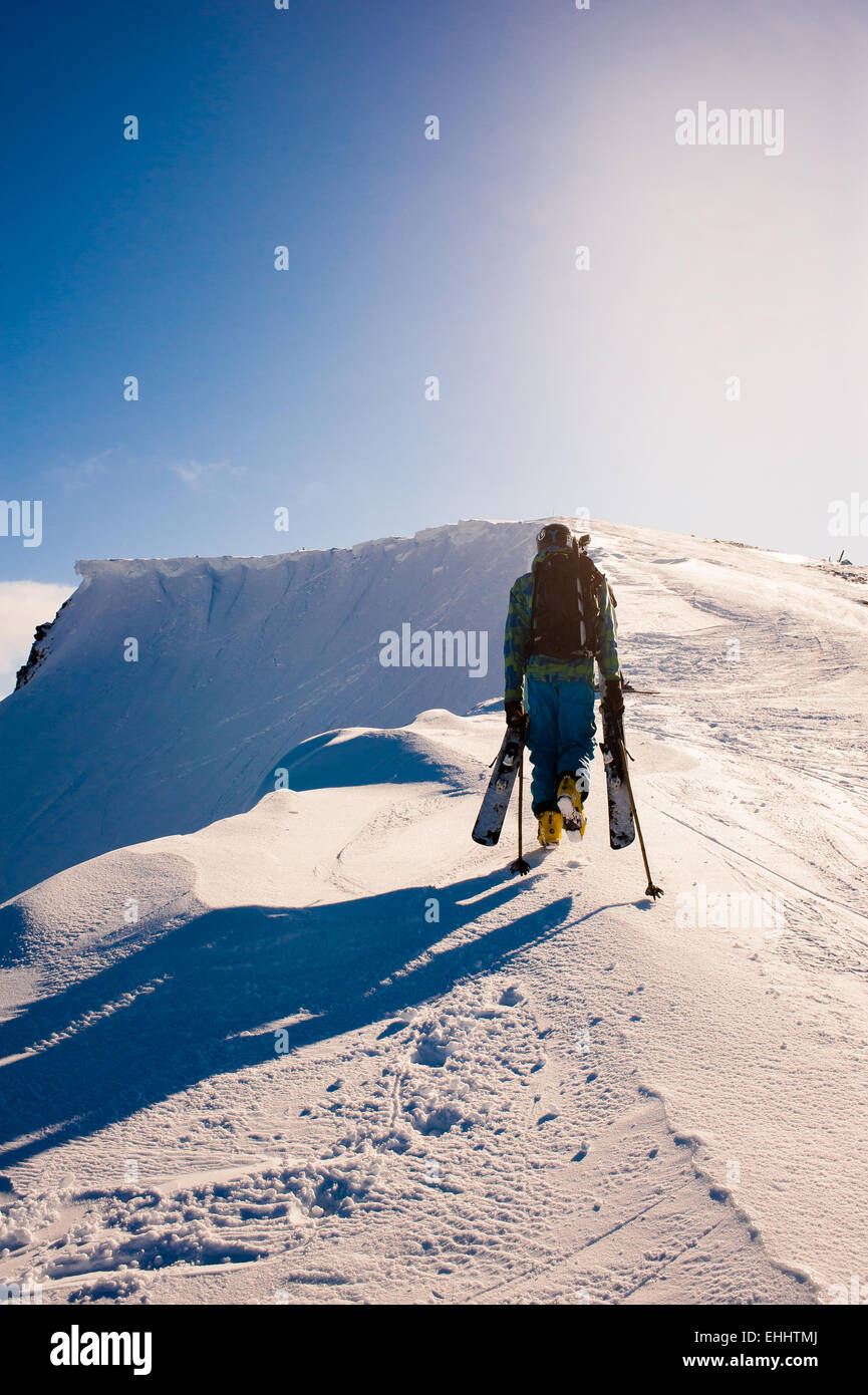 Ski skier skiing walk carry trudge uphill hi-res stock photography and ...