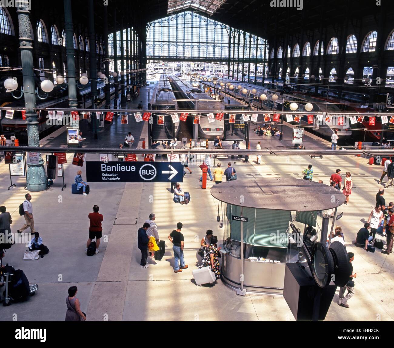 Trains alongside platforms in the Gare du Nord railway station with ...