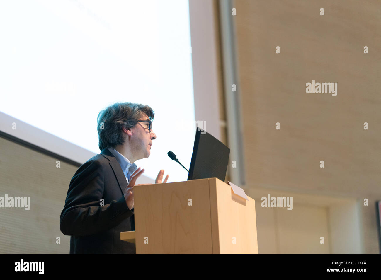 Speaker giving talk on podium at Business Conference Stock Photo - Alamy