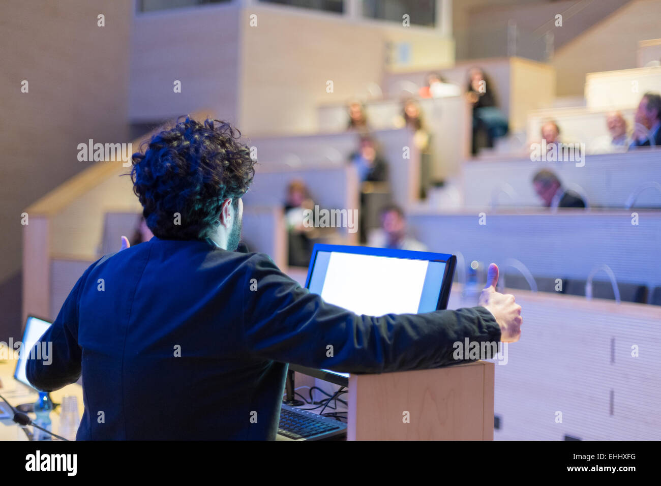 Speaker giving talk on podium at Business Conference Stock Photo - Alamy