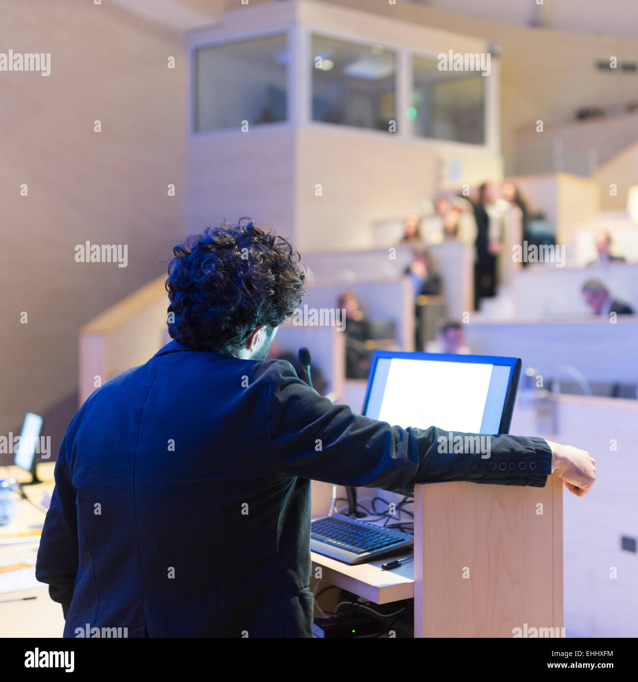 Speaker giving talk on podium at Business Conference Stock Photo - Alamy