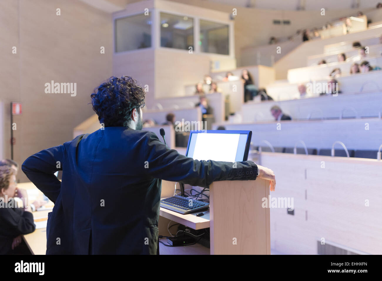 Speaker giving talk on podium at Business Conference Stock Photo - Alamy