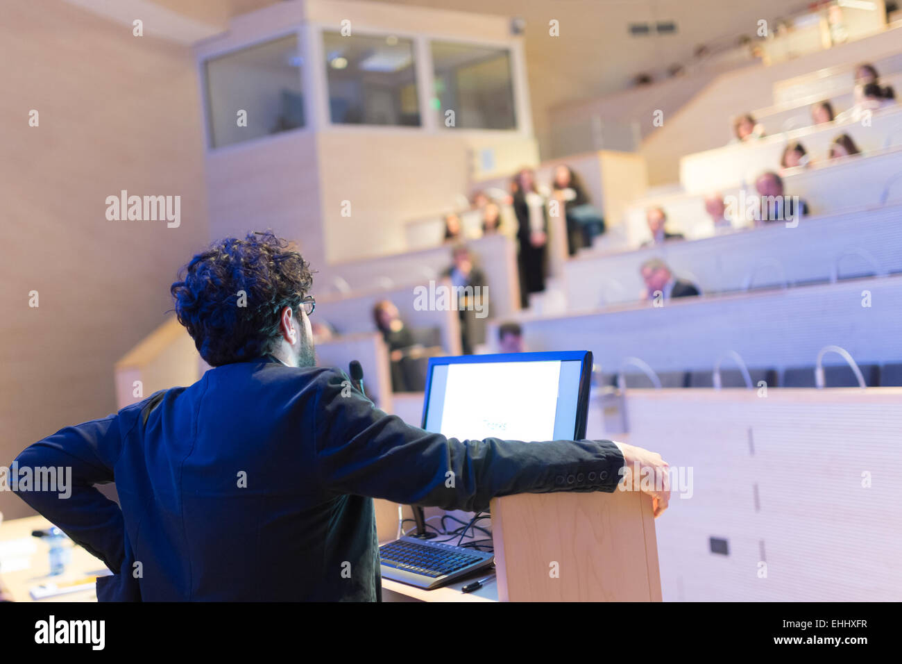 Speaker giving talk on podium at Business Conference Stock Photo - Alamy