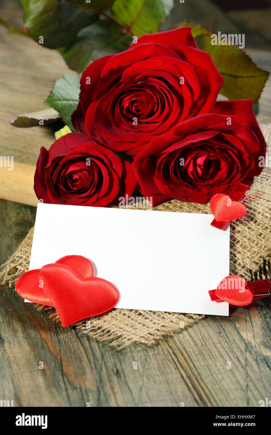 Red hearts, postcard and roses Stock Photo - Alamy