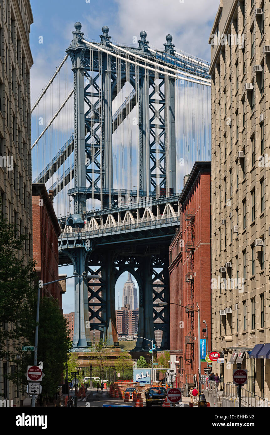 Manhattan bridge in New York City with beautiful blue sky in background ...