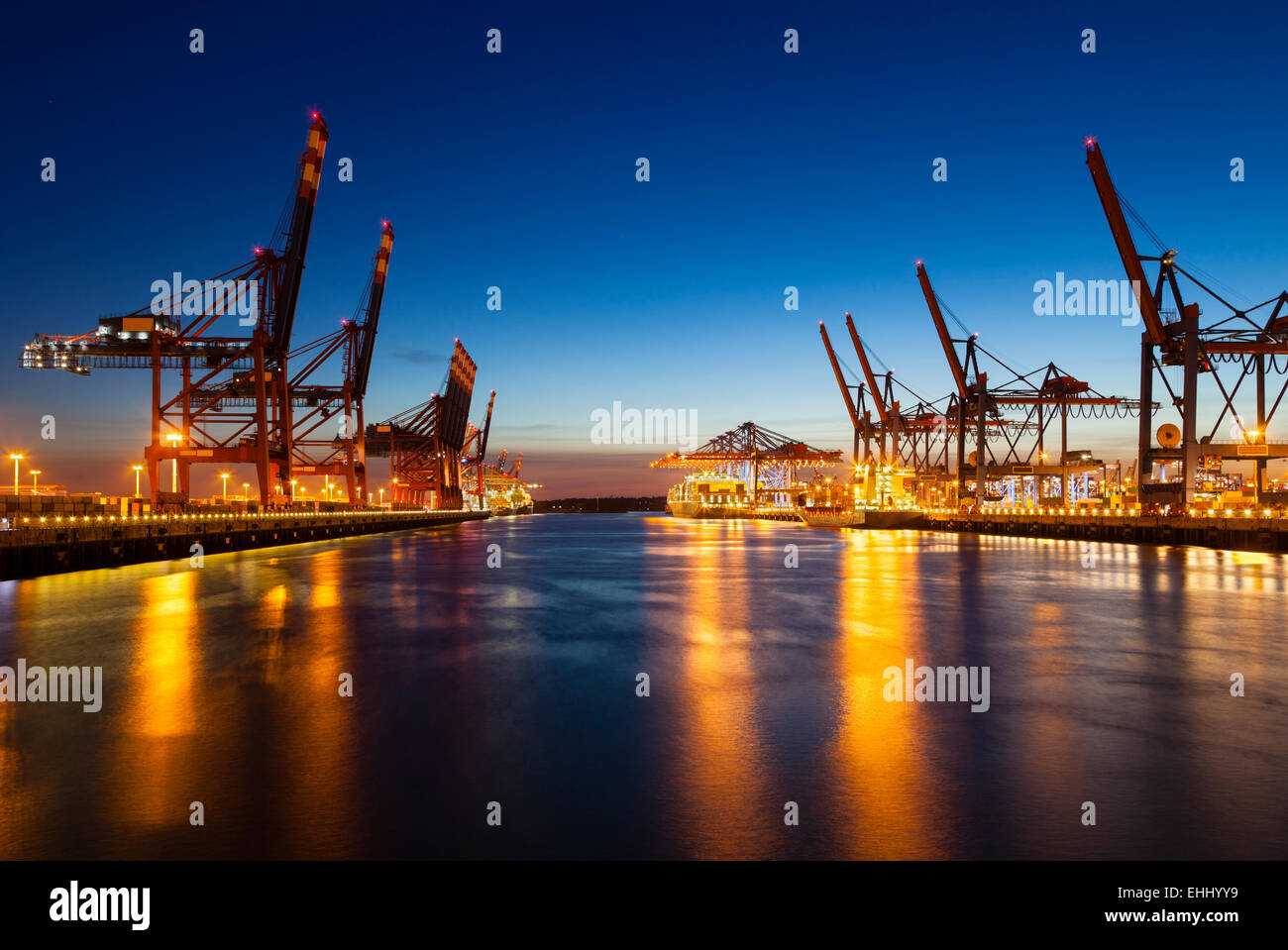 A large container harbor with deep blue night sky Stock Photo - Alamy